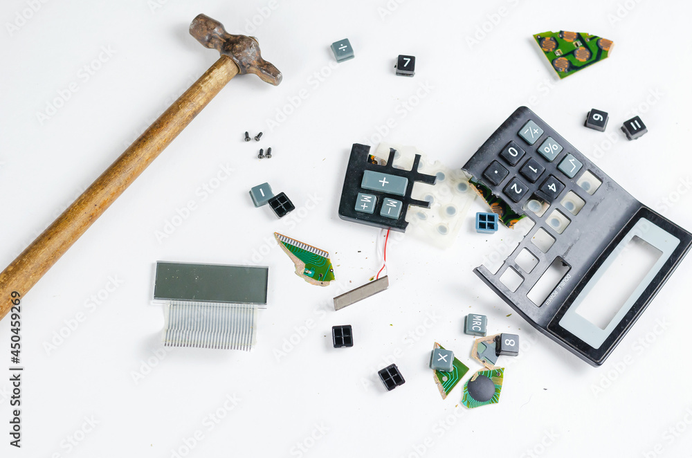 Hammer and Broken into pieces calculator on white background. Bu Stock ...