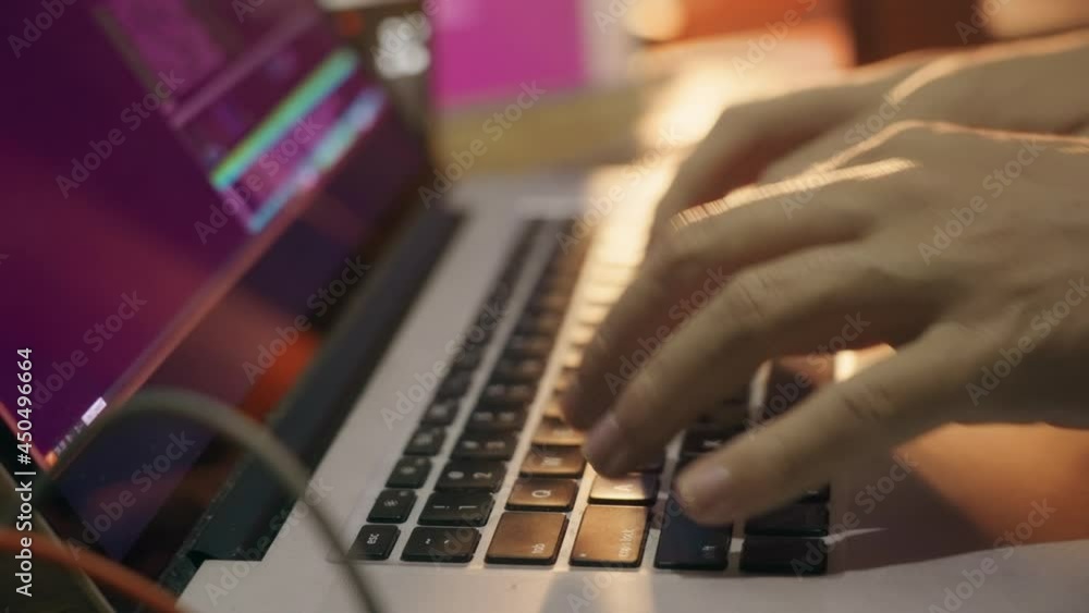 The hacker programmer starts working. A person stretches his fingers and turns on a computer ...