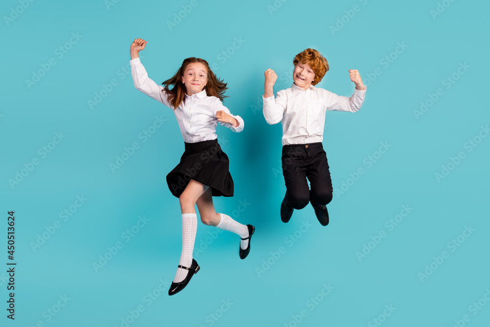 Full length body size view of two cheerful kids jumping having fun ...