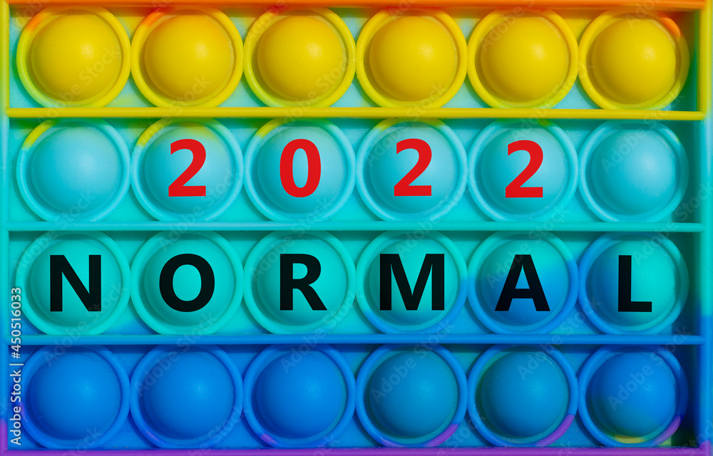 Symbol of covid-19 normal in 2022. Words 'Normal 2022' on rainbow Pop ...