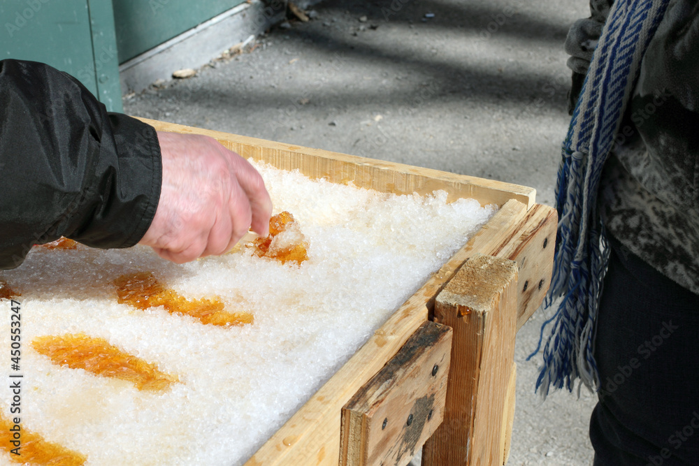 Rolling Maple Taffy On A Bed Of Snow Traditional Quebec Treat Taffy ...