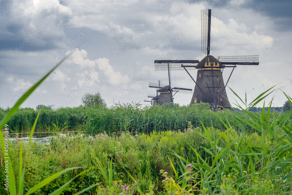 Typical Dutch landscape in vintage colors with windmills and water ...