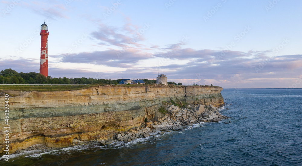 Sunset colored limestone cliff on Pakri peninsula, Estonia with the ...