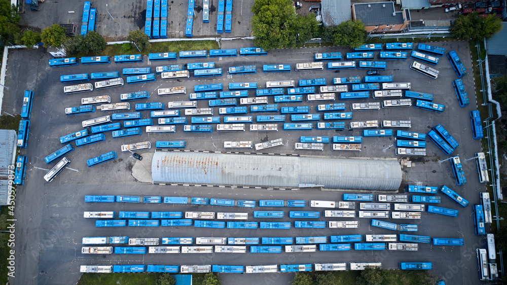 Top down aerial view directly above the abandoned trolley buses in a ...