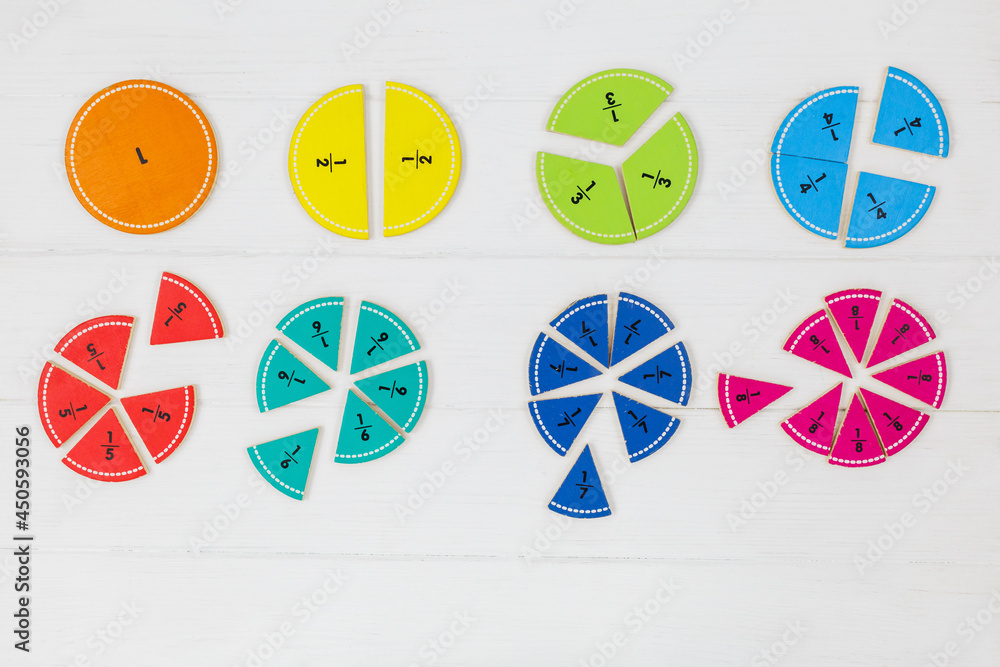 Multicolored fractions, blocks on white wooden table. Back to school ...