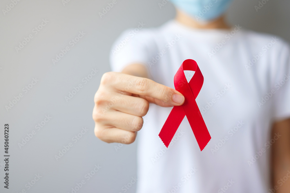 Hand holding Red Ribbon for December World Aids Day (acquired immune ...