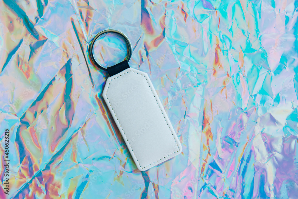 Keychain mockup on holographic background to display design. Blank ...