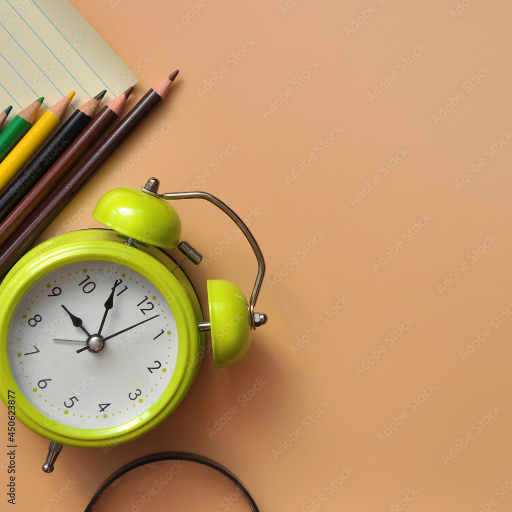 Bright school background with pencils and an alarm clock Stock Photo ...