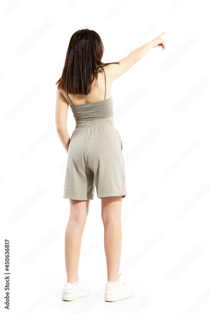 Back view of black hair young summer woman pointing direction guiding ...