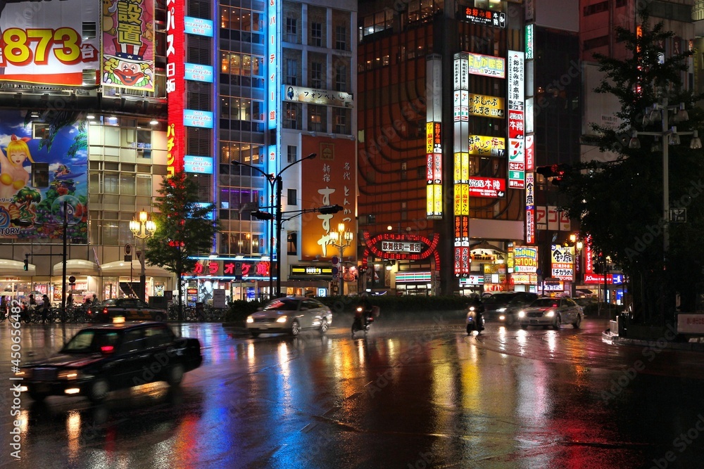 TOKYO, JAPAN - MAY 9, 2012: Rain in Shinjuku district, Tokyo. Shinjuku ...