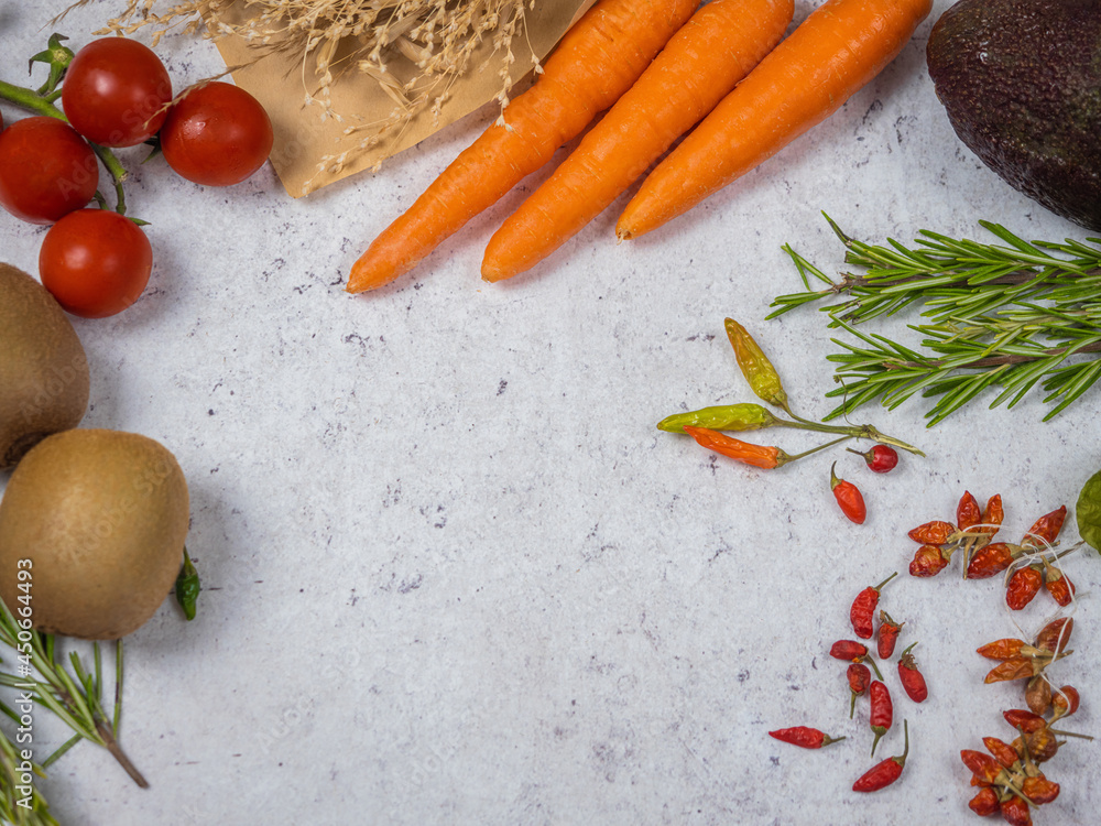Food background. Top view of food, tomato, rosmarine, pepper, carrots ...