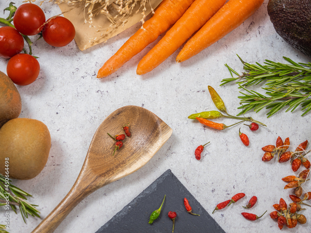 Food background. Top view of food, tomato, rosmarine, pepper, carrots ...