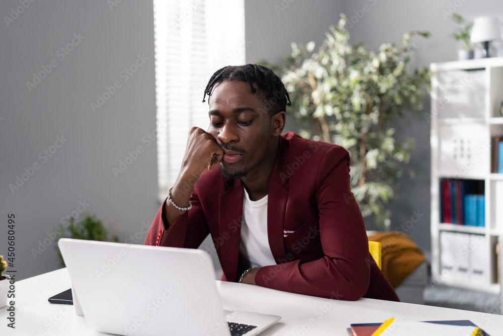 Bored tired sleepy office worker supports face with fist clenched in ...