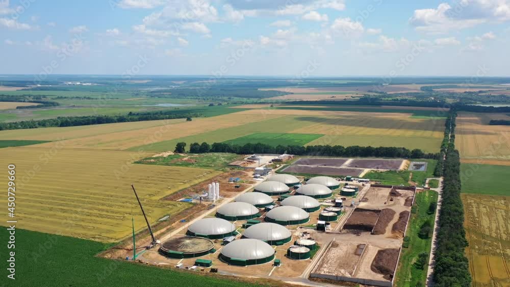 Production of biogas. New plant constructed on fields. Renewable energy from biomass. Modern ...