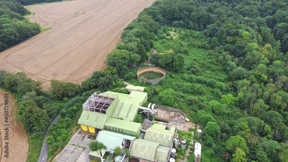 Aerial reverse birdseye view over the now-abandoned Thruxted Mill near ...