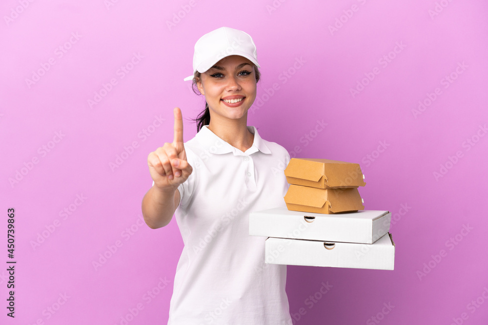 Pizza delivery Russian girl with work uniform picking up pizza boxes ...