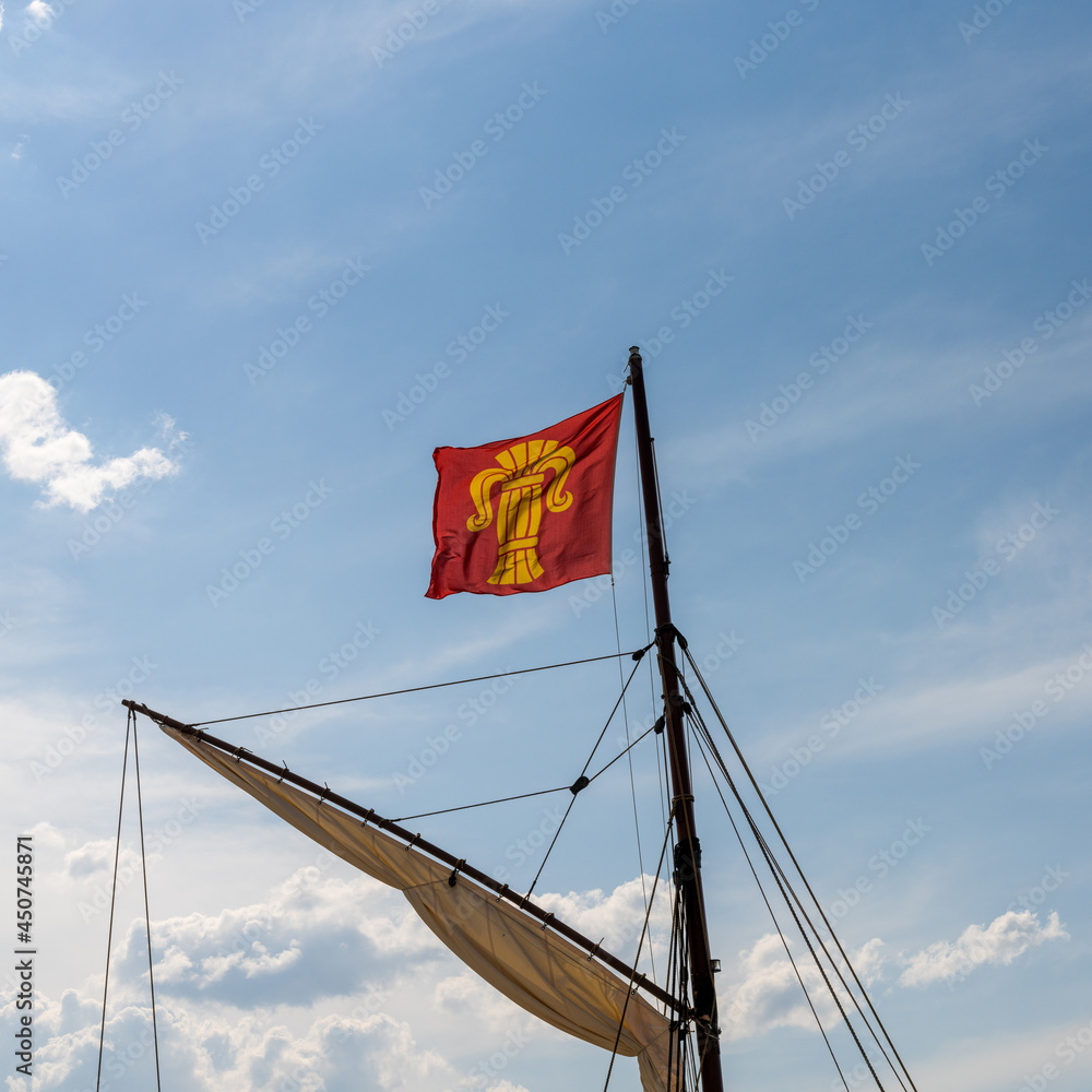 flag of the Finnish city of Vaasa flying in a strong wind from the mast ...