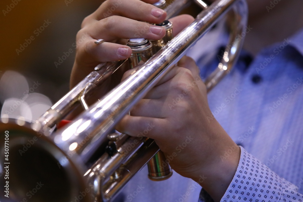 Kid playing trumpet musical instrument bugle close up background image ...