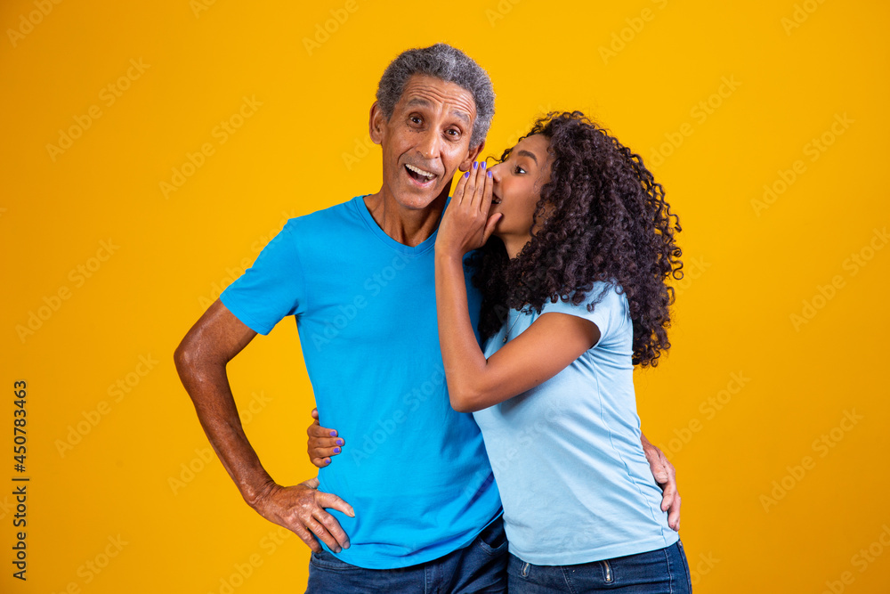 daughter talking softly in the ear a secret for the father Stock Photo ...