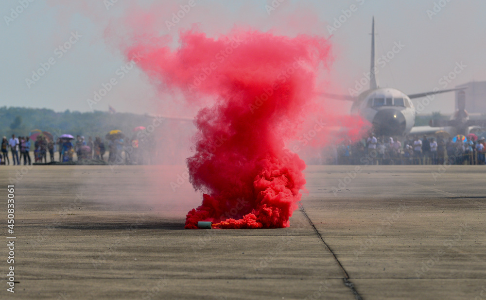 Red smoke signal test performance during emergency drills by emitting ...
