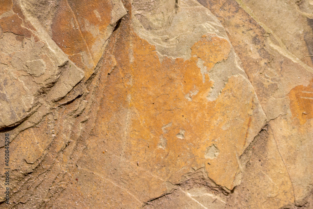 Raw rock in orange with minerals and metals as natural stones ...