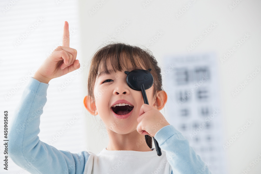 Lovely little girl test visual acuity Stock Photo | Adobe Stock