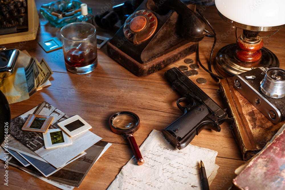 Private detective's desk, noir still life with a vintage phone ...