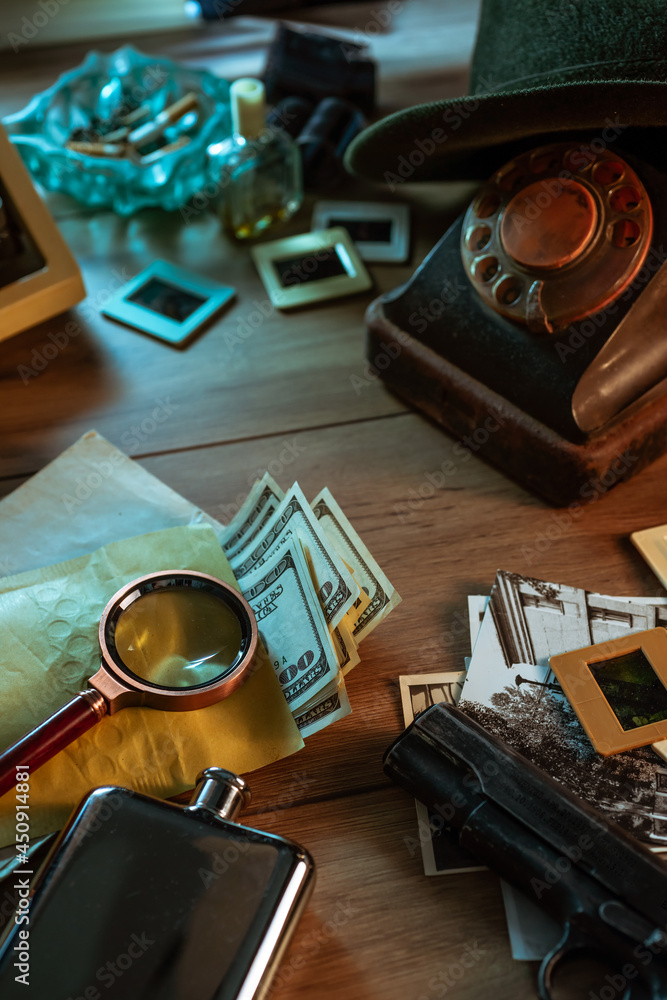 Private detective's desk, noir still life with a vintage phone ...