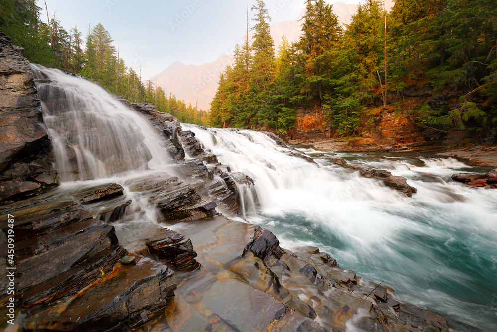 Sacred Dancing Cascade at sunset, Glacier National Park. Sacred Dancing ...