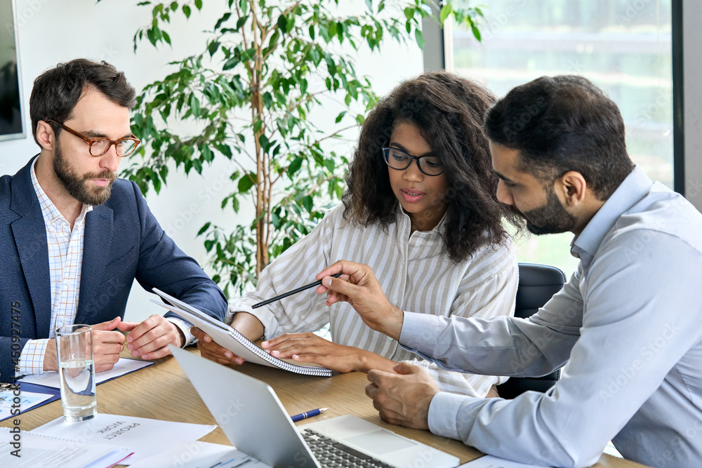Foto de International executive business people team negotiating financial research report at ...