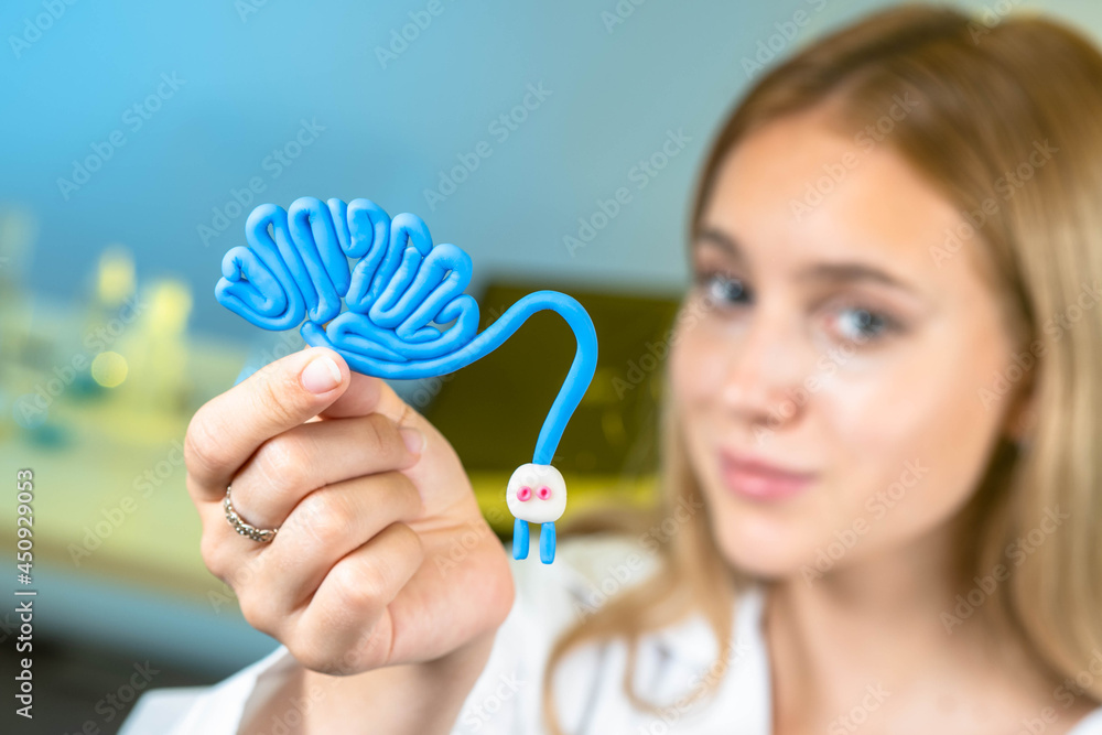 Human brain. Rosette as symbol of development of brain. Batman holds ...