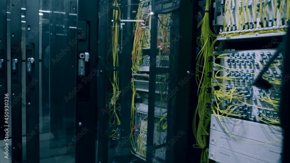 Camera moves through big working data center with server racks . Real ...