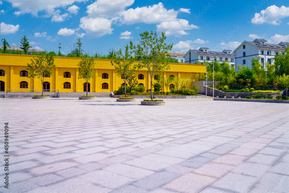 Park Square slate pavement in front of the yellow building Stock Photo ...