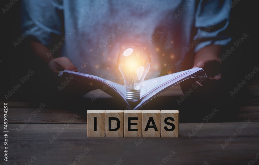 People reading books to create ideas for work.Concept of the idea of ...