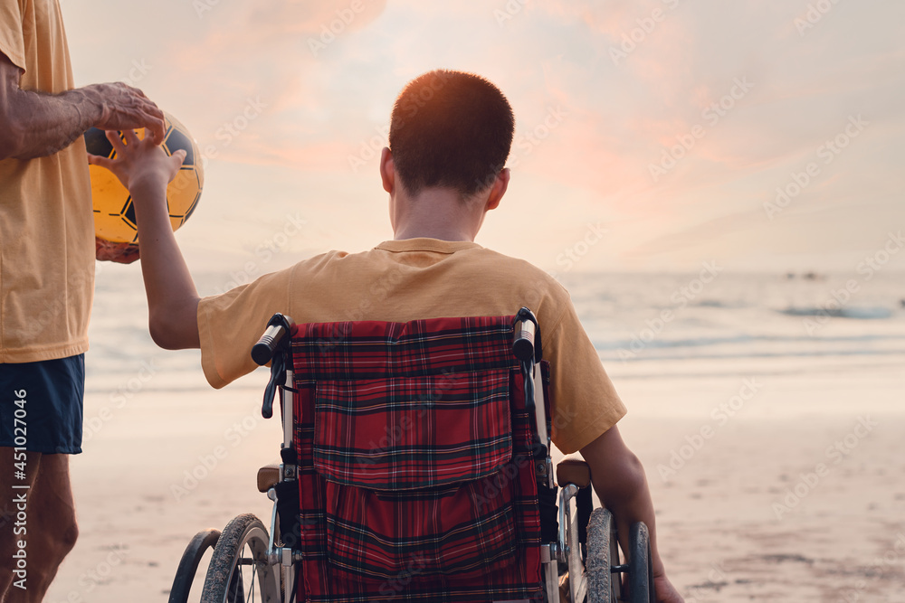 Happy disabled teenage boy on wheelchair playing a ball, Activity ...