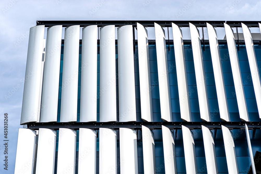 The facade of a modern building with an innovative facade made of ...