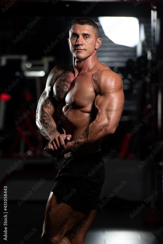 Bodybuilder Performing Side Chest Pose Stock Photo | Adobe Stock