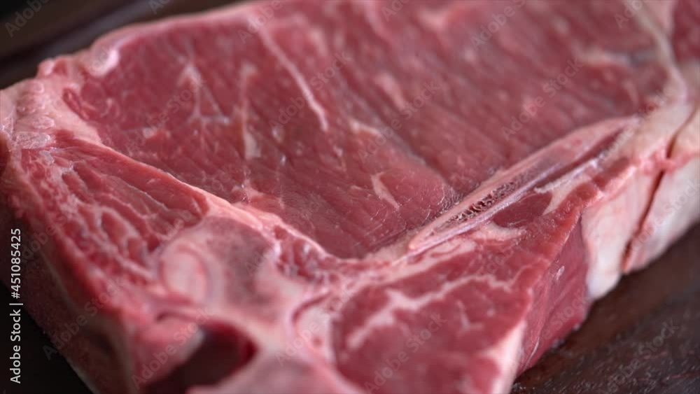 Super close-up of T-bone steak - raw marble beef fillet, aged prime ...