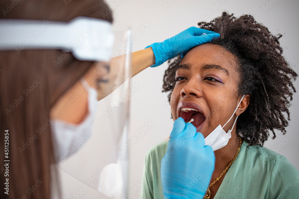 Doctor wearing personal protective equipment performing a Coronavirus ...