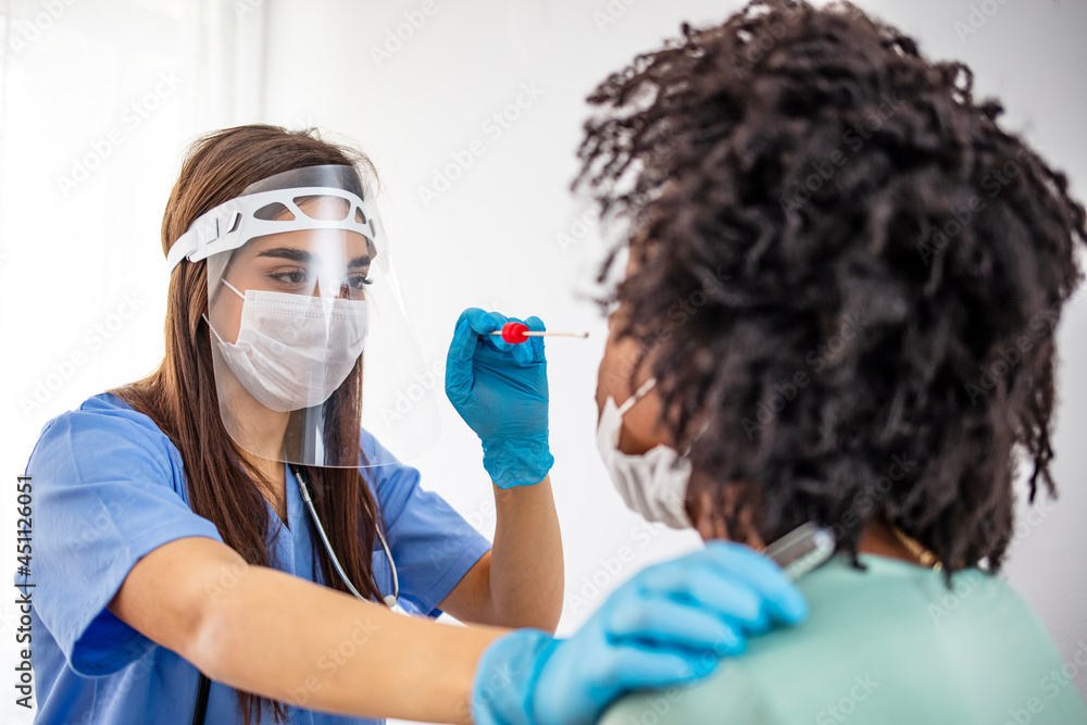 Close-up of healthcare worker taking PCR test at medical clinic. Close ...