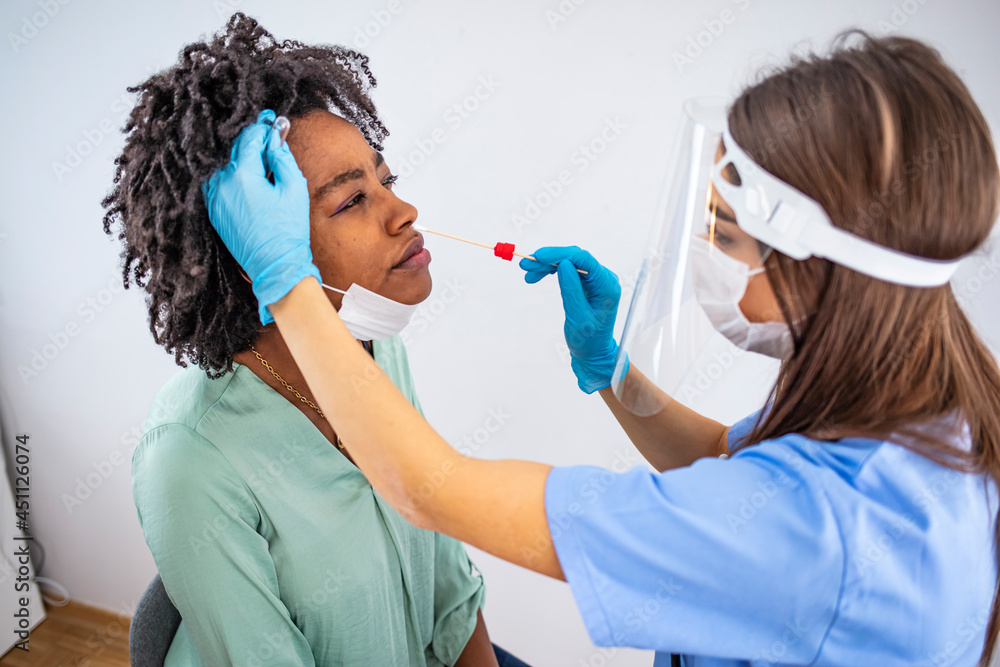 Shot of a doctor using cotton swab while doing coronavirus PCR test at ...