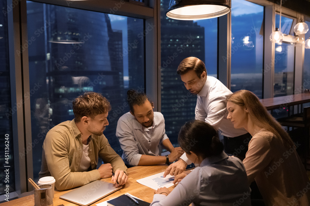Multiracial ambitious team discuss sales stats seen in chart and graphs ... Multiracial ambitious team discuss sales stats seen in chart and graphs ...