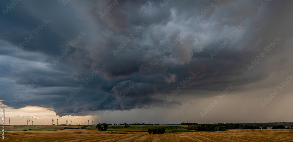 ThunderStorm over fields, a huge storm cloud that causes heavy rainfall ...