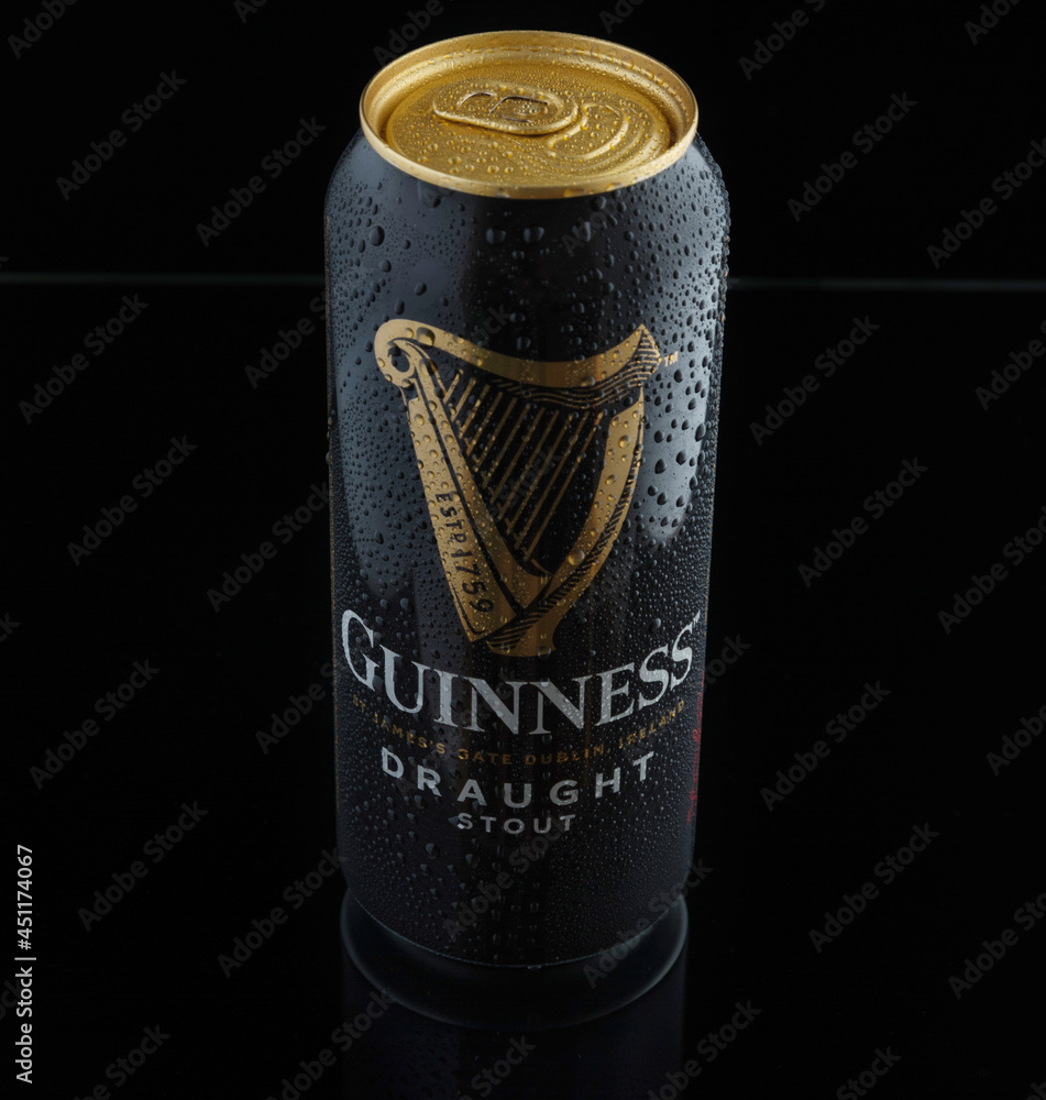 canned beer guinness on dark background with water droplets Stock Photo ...
