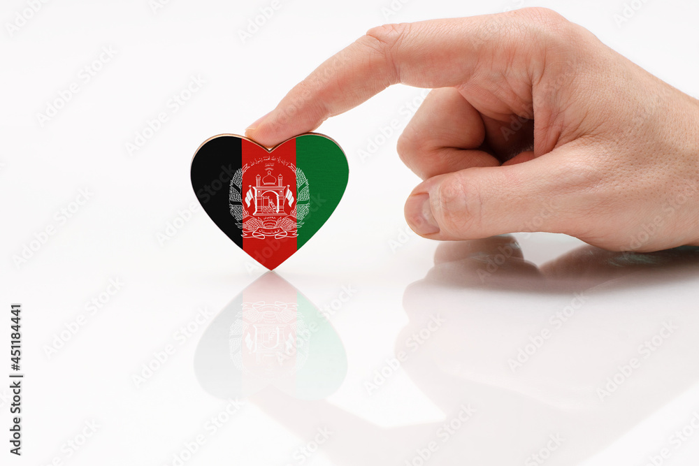 Afghanistan flag. Love and respect Afghanistan. A man's hand holds a ...