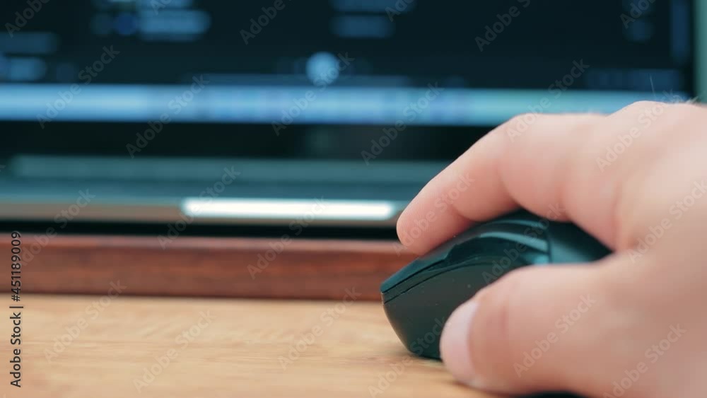 Hand uses and damages bad working wireless mouse on the desk table ...