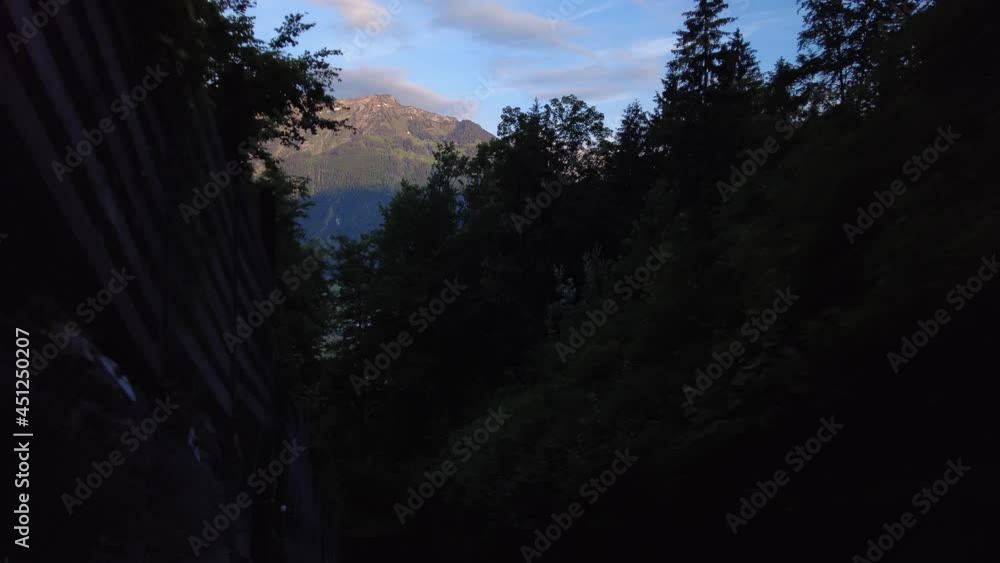 Red Funicular Train driving downhill from Harder Kulm, Top of ...