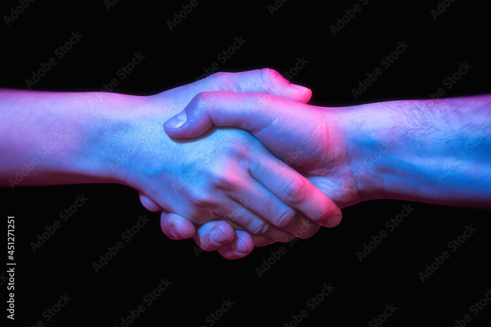 Hands of a man and a woman are connected by a handshake. Metaphor of ...