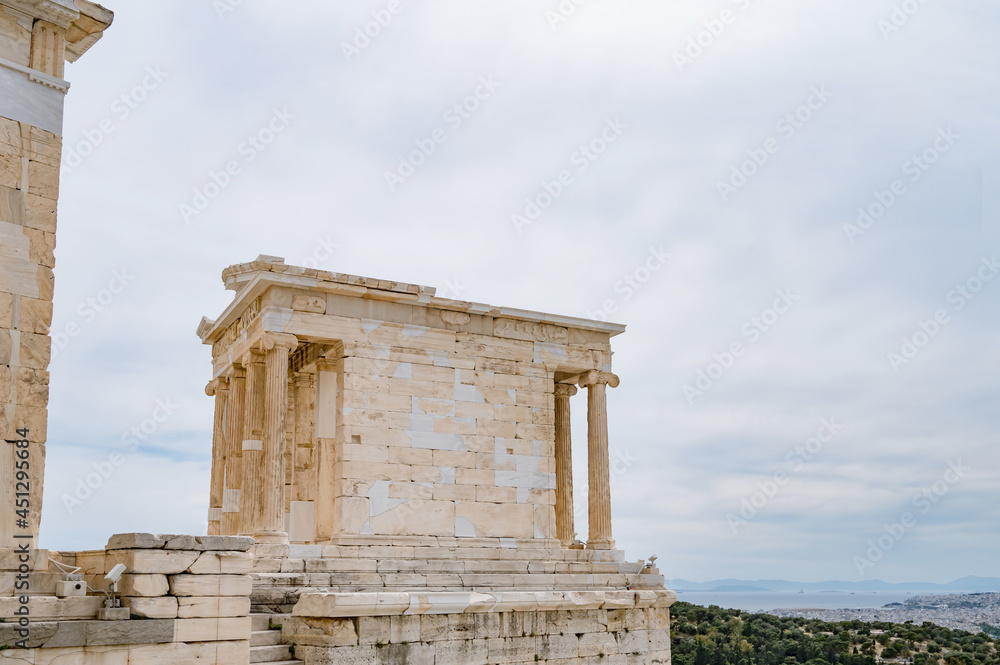 Cityscape of Athens from Acropolis hill. Ruins Temple of Athena Nike on ...