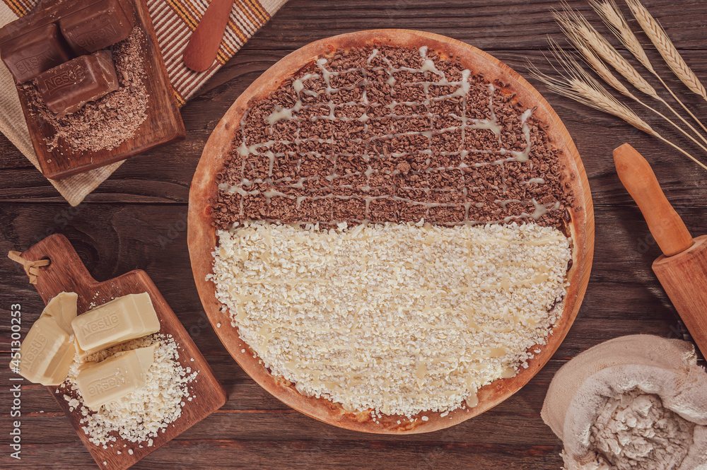 Brazilian sweet pizza half chocolate and half white chocolate with ...